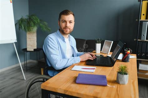 Computer Programmer Writing Program Code On Computer In Office Stock