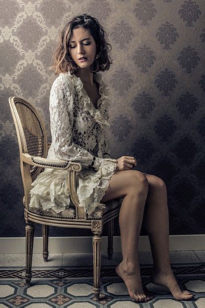 Premium Photo Elegant Woman Sitting In A Chair Sitting Pose
