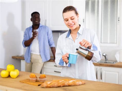 Cheerful Wife And Husband Drinking Coffee At Home In Morning Stock