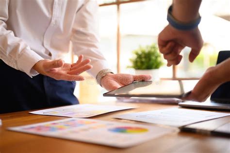 Creative People Brainstorming For Mobile Application Software Design Project At Office Stock