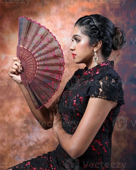 South East Asian Indian Race Ethnic Origin Woman Wearing Chinese Dress Costume Cheongsam Holding