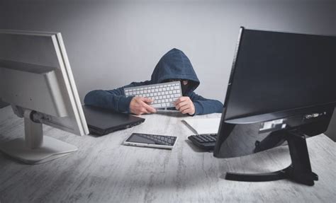 Premium Photo Hacker Stealing Information From The Office Computer Hacking Criminal