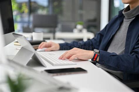 Cropped Asian Male Developer Or Programmer Working At Her Desk Typing On Keyboard Stock Image