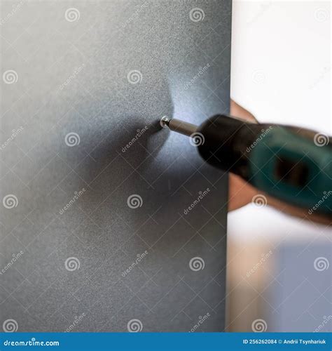 The Process Of Screwing The Screw Installation Of A Sliding Door