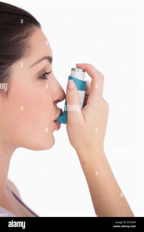 Woman Using Asthma Inhaler Stock Photo Alamy