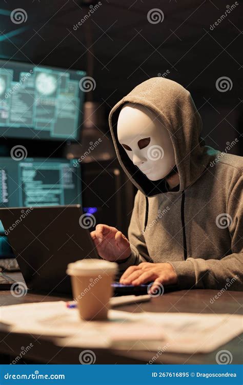 A Dangerous Masked Hacker With A Hood Cannot Infiltrate The Data
