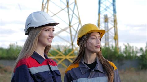 Two Women Energy Workers Conducts An Inspection Of Equipment And Power Lines Stock Video Video