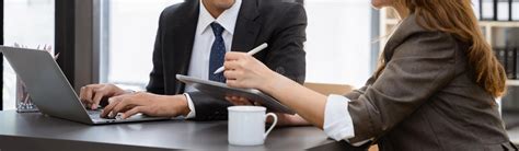 Business Team Or Financial Data Analysts Working With Tablets And Laptop Computers And Data