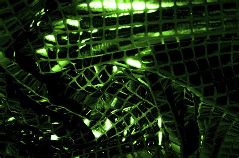 텍스처 배경 패턴입니다 녹색 큰 Paillettes 가진 직물에 의하여 이루어져 있다 큰 반짝임의 이러한 여러 가지 빛깔된의 기름 얼룩과 관심에 대 한 준비가 되어 날카로운