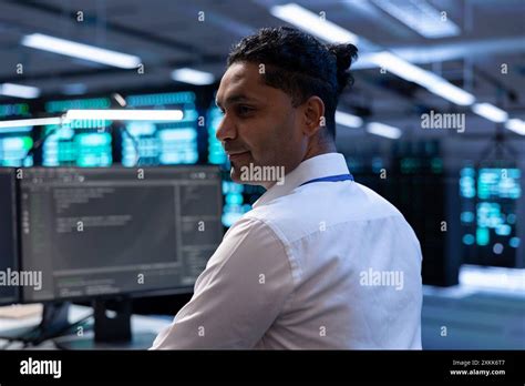 Computer Scientist In Data Center Using Diagnostic Tools And System Monitoring Software To