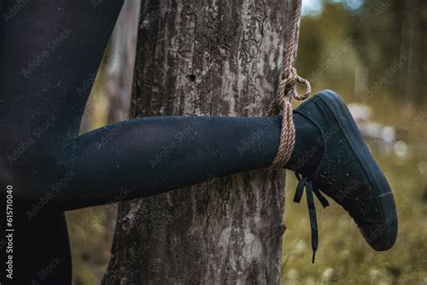 Tied Up Legs Of A Woman In Green Body And Black Tights With A Natural Rope Japanese Art Of