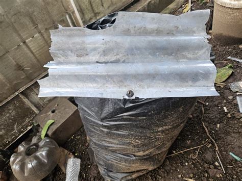 Temporary Trash Storage With Metal Sheet Cover Stock Image Image Of