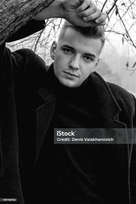 Closeup Fashion Male Model In Coat Black And White Photo Art Portrait