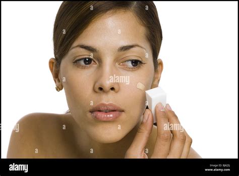 Woman Applying Foundation With Makeup Sponge Stock Photo Alamy