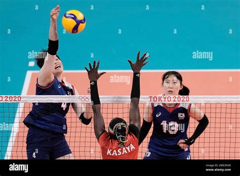 South Koreas Kim Hee Jin Spikes A Ball Against Kenyas Leonida Kasaya