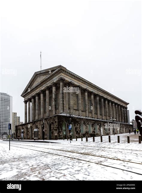 The Ancient Architecture Of Birmingham Town Hall During The Cold Winter Months With Snow On The