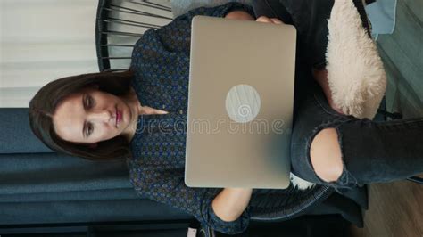 Female Typing On Laptop Keyboard Working From Home Office Vertical