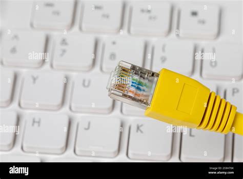 Ethernet Cable And Computer Keyboard Lan Network Data Transfer Speed And Internet Connection