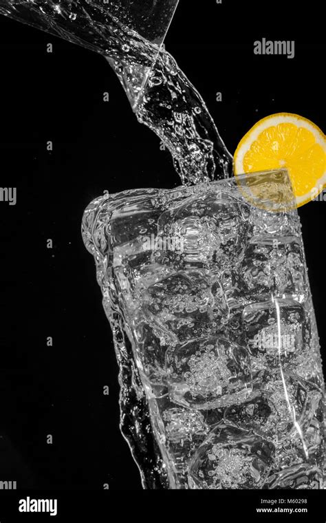 Sparkling Water Overflow Over Ice Cubes Stock Photo Alamy
