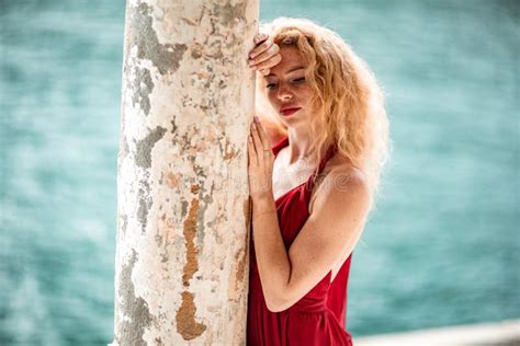 Outdoor Portrait Of A Young Beautiful Natural Redhead Girl With