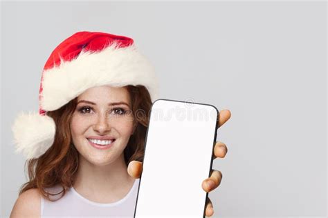 Christmas Woman Santa Showing Smartphone With Blank Empty White Screen Display For New
