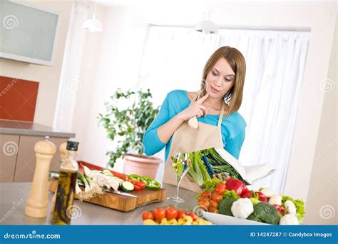 Cooking Woman Reading Cookbook In Kitchen Stock Image Image Of