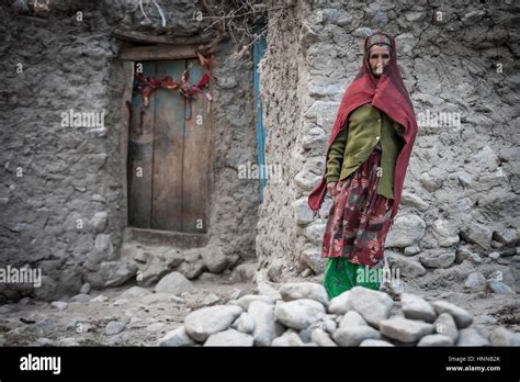 Afghanistan Wakhan Corridor A Portrait Of An Old Smiling Woman In Traditional Colored Clothes