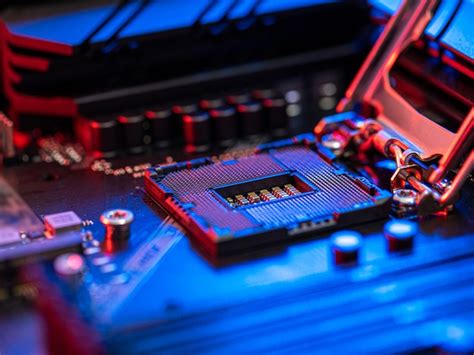 Premium Photo Manipulating And Installing Processor On The Motherboard In Details With Blur