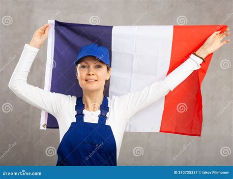 Smiling Adult Woman In Uniform Holding France Flag Stock Image Image