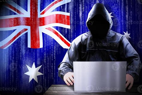 anonymous hooded hacker and flag of australia binary code cyber