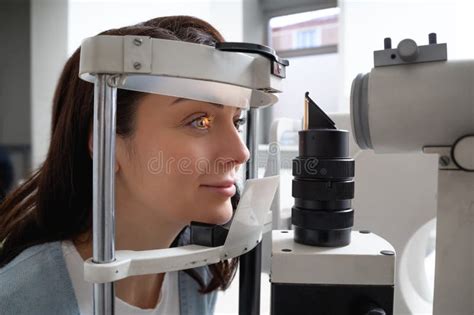 Woman Patient Testing Vision In Optometry Clinic Measuring Eyesight