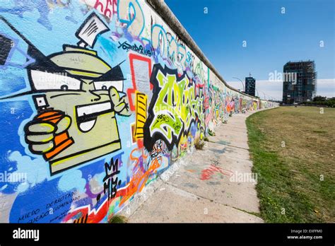Graffiti On Original Section Of Berlin Wall At The East Side Gallery In