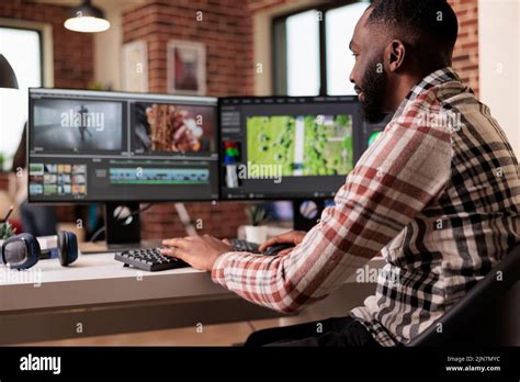 African American Filmmaker Creating Video Footage Using Editing Sofware To Make Post Production