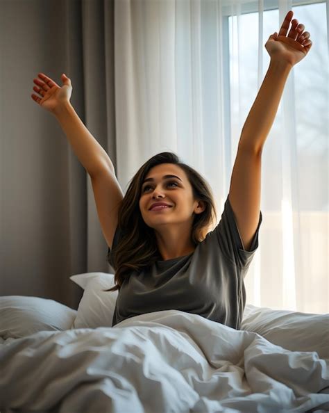 A Woman Is Laying In Bed With Her Arms Raised In The Air Premium Ai