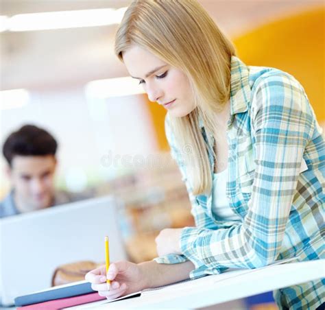 Girl Reading And Writing In Notebook Or Classroom For Study Group
