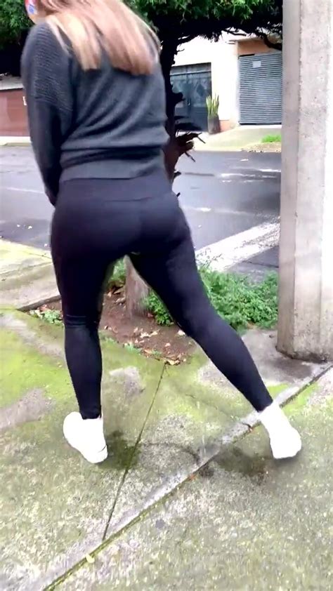 Pissing Her Leggings On Sidewalk