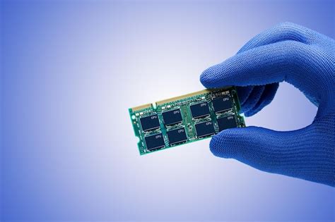 Premium Photo Electronic Engineer Hand Holding Modern Computer Chip Chipset On Blue Background