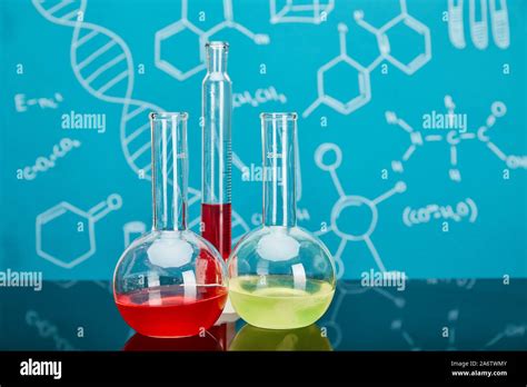 Glass Test Tube And Flasks With Colorful Liquid On Blue Background With