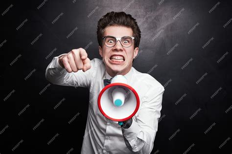 Premium Photo Man Nerd In Glasses Pointing At Camera And Speaking In