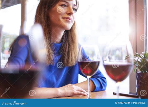 Beautiful Woman Drinking Red Wine With Friends In Cafe Portrait With