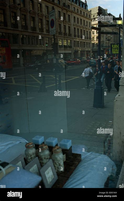 Street Scene Reflected On A Shop Window On Regent Street In London
