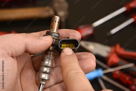 Mechanic Illustrates The Connector For Oxygen Sensor Stock Photo Adobe Stock