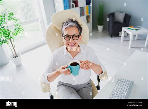 Upper View Of Grey Hair Successful Business Lady Drink Sweet Coffee