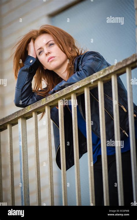 A Moody Sad Solo Redhead Ginger Haired Young Woman Teenager Girl Alone