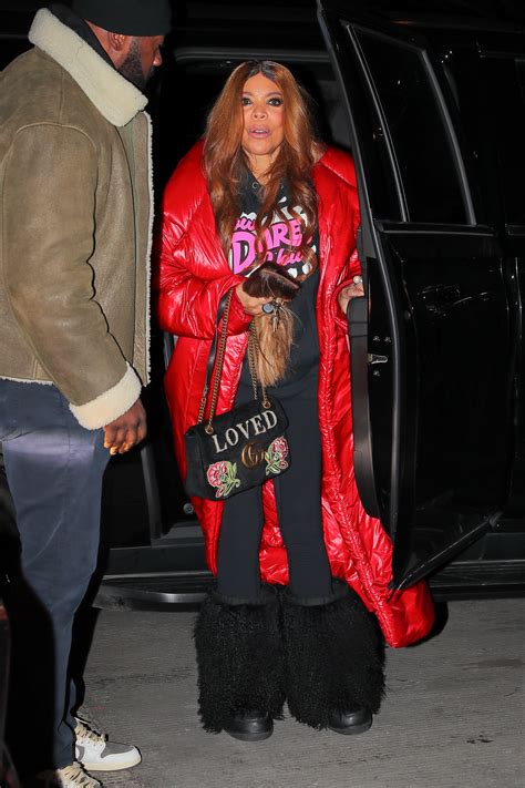 Wendy Williams Carries Her Own Wig As She Holds Onto Friends Arm In