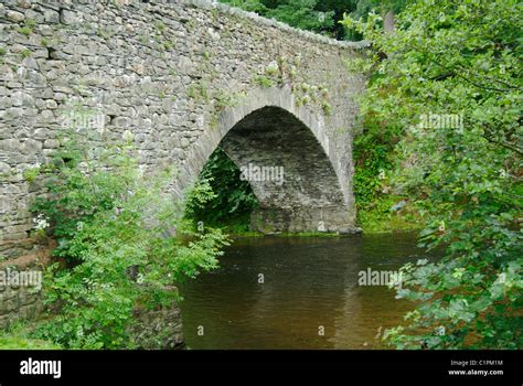 England Cumbria Keswick Stone Arch Bridge Over River Greta Stock