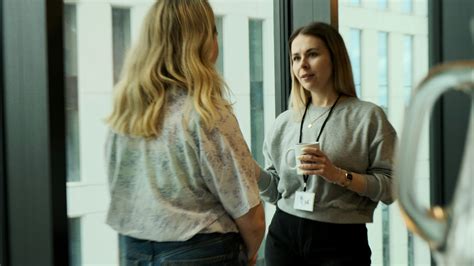 Two Women Standing In Front Of A Mirror Talking Photo Free Face Image