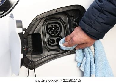 Man Clean Charge Port On Electric Stock Photo Shutterstock
