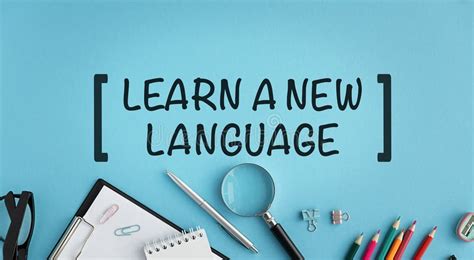 Learn A New Language Text Written On Blue Paper With Pencils In Office