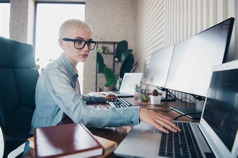 Modern Young Professional Woman Working In A Casual Home Office Setup With A Focus On Technology